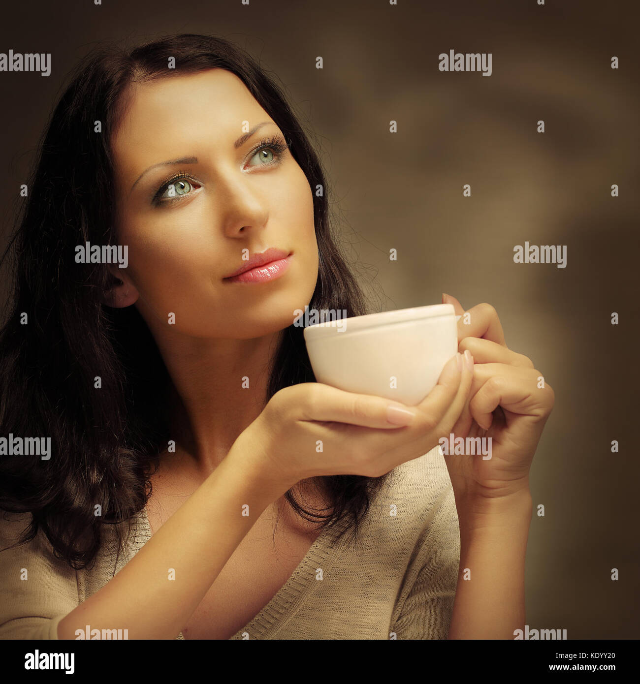 Woman drinking coffee (focus on the model's eyes Stock Photo - Alamy