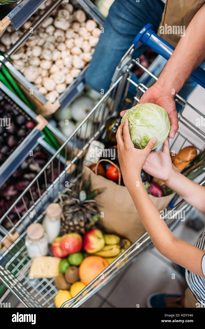 child helping parent shopping Stock Photo - Alamy