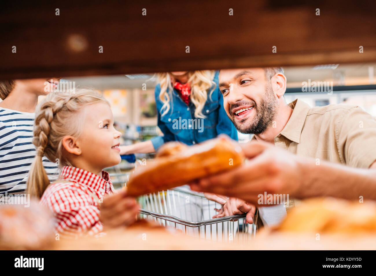 family buying pastry Stock Photo - Alamy