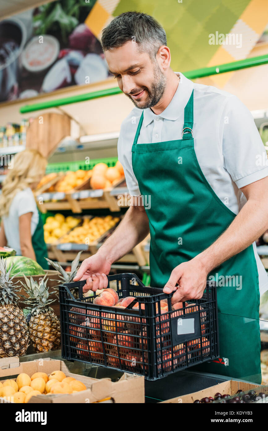 shop assistant in grocery shop Stock Photo - Alamy