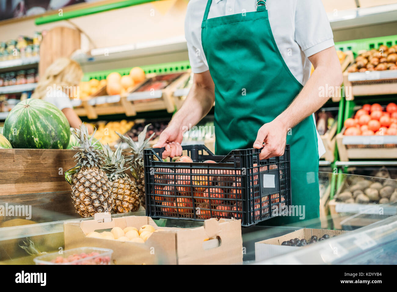 shop assistant in grocery shop Stock Photo - Alamy