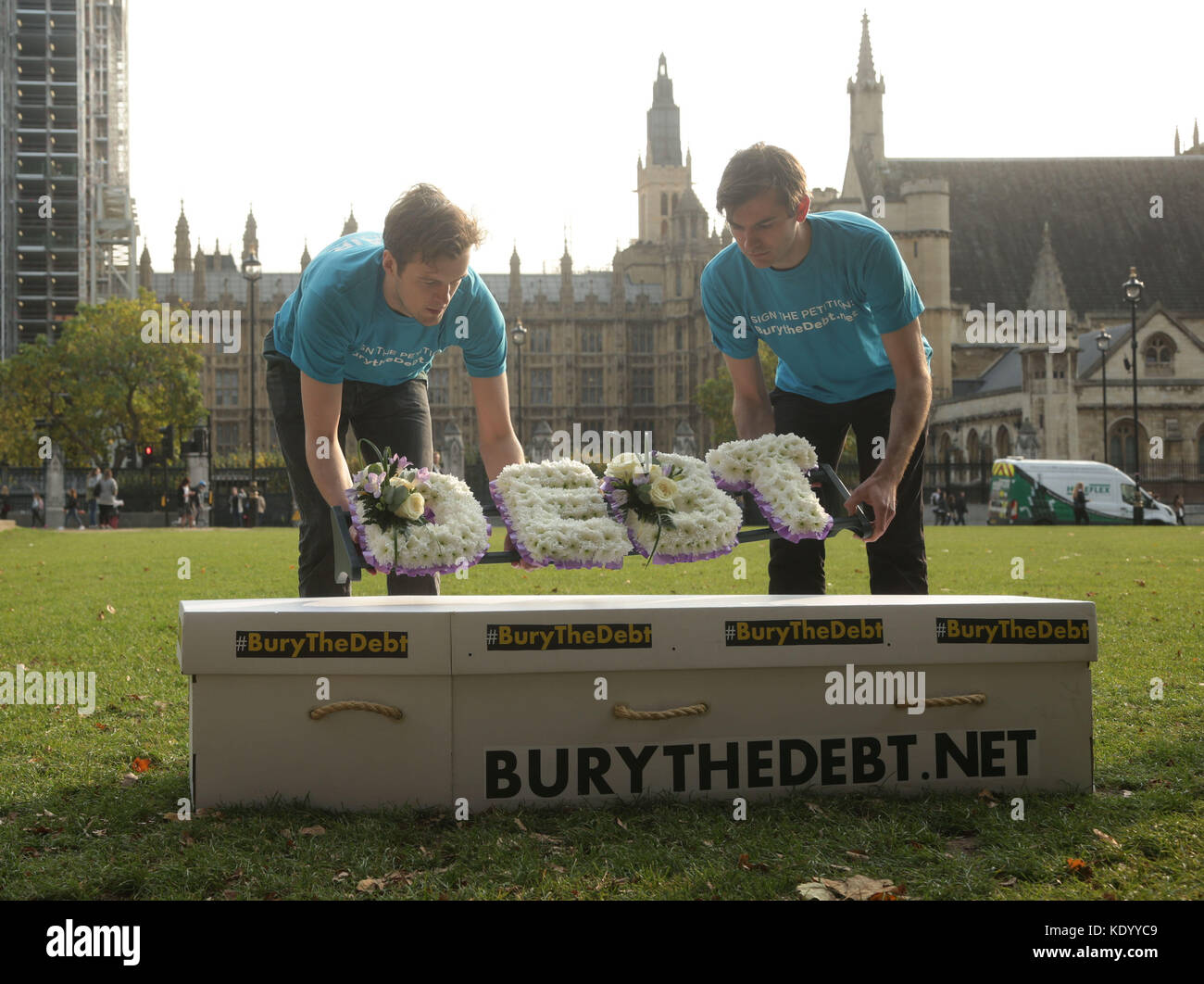 A mock coffin is laid in Parliament Square, London, during a protest ...