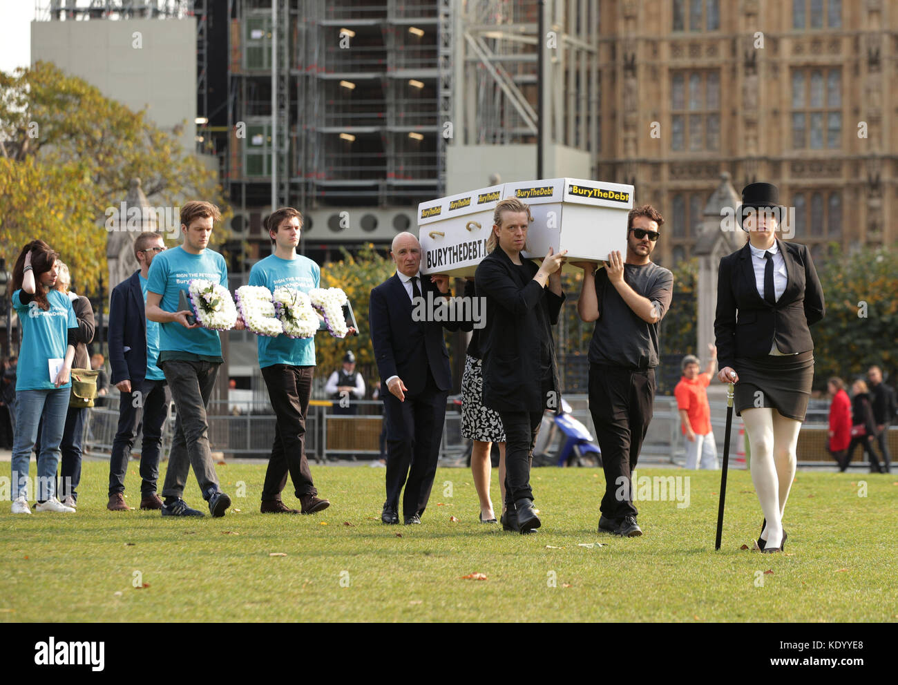 A mock coffin is carried in Parliament Square, London, during a protest ...