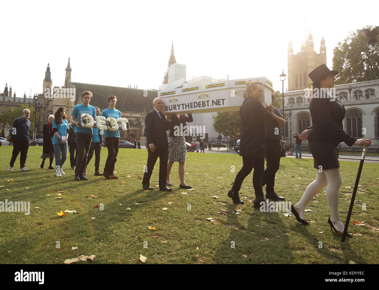 A mock coffin is carried in Parliament Square, London, during a protest ...