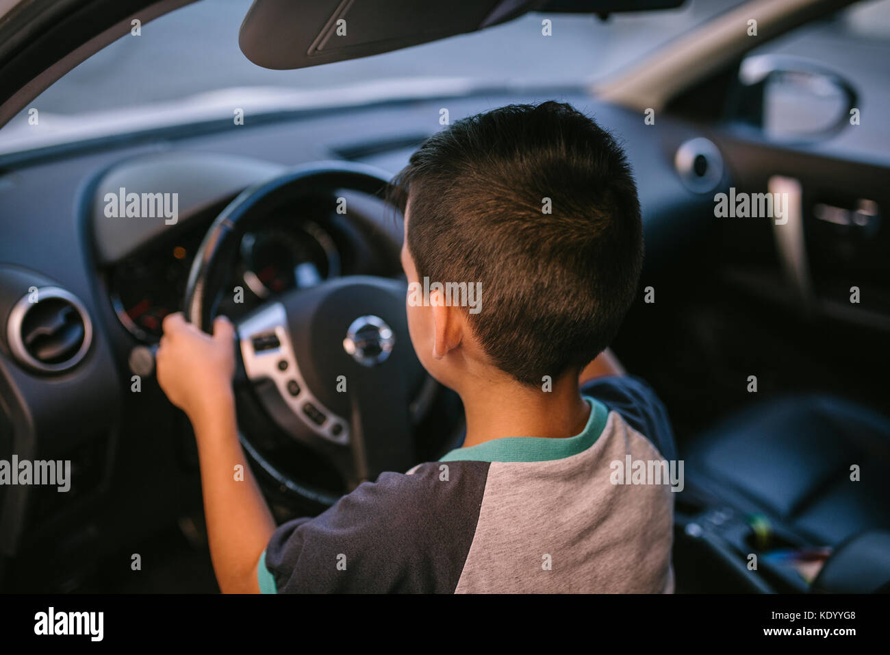 Boy driving a car Stock Photo - Alamy