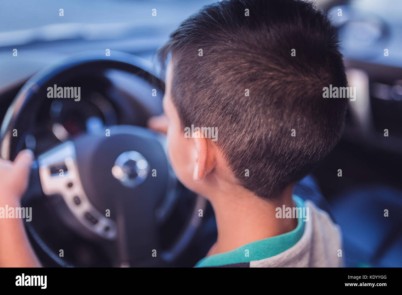 Boy driving a car Stock Photo - Alamy
