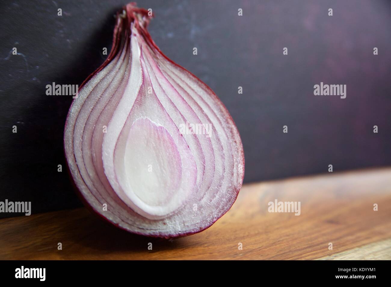 Cross section of a red onion showing the beauty of shapes,tones and ...