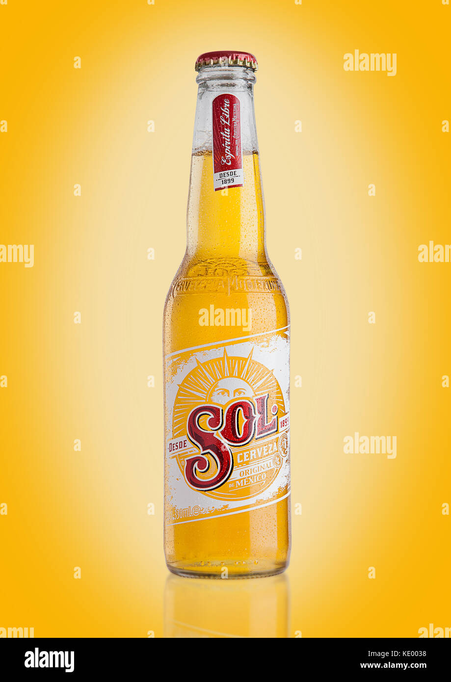LONDON, UK - DECEMBER 15, 2016: Bottle of Sol Mexican Beer on yellow ...