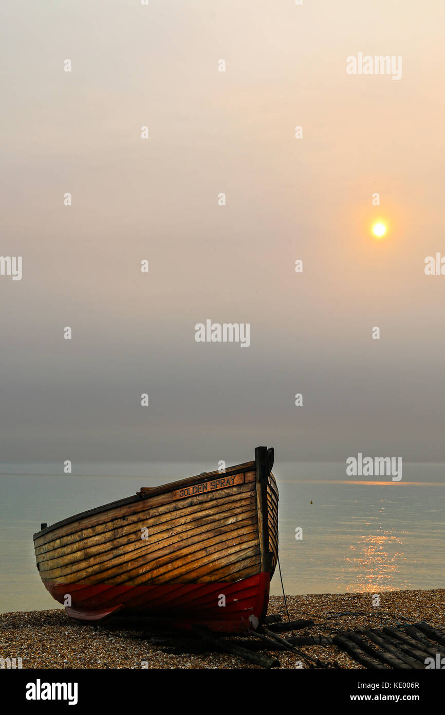 Golden Spray Boat - Saharan Sky Stock Photo - Alamy