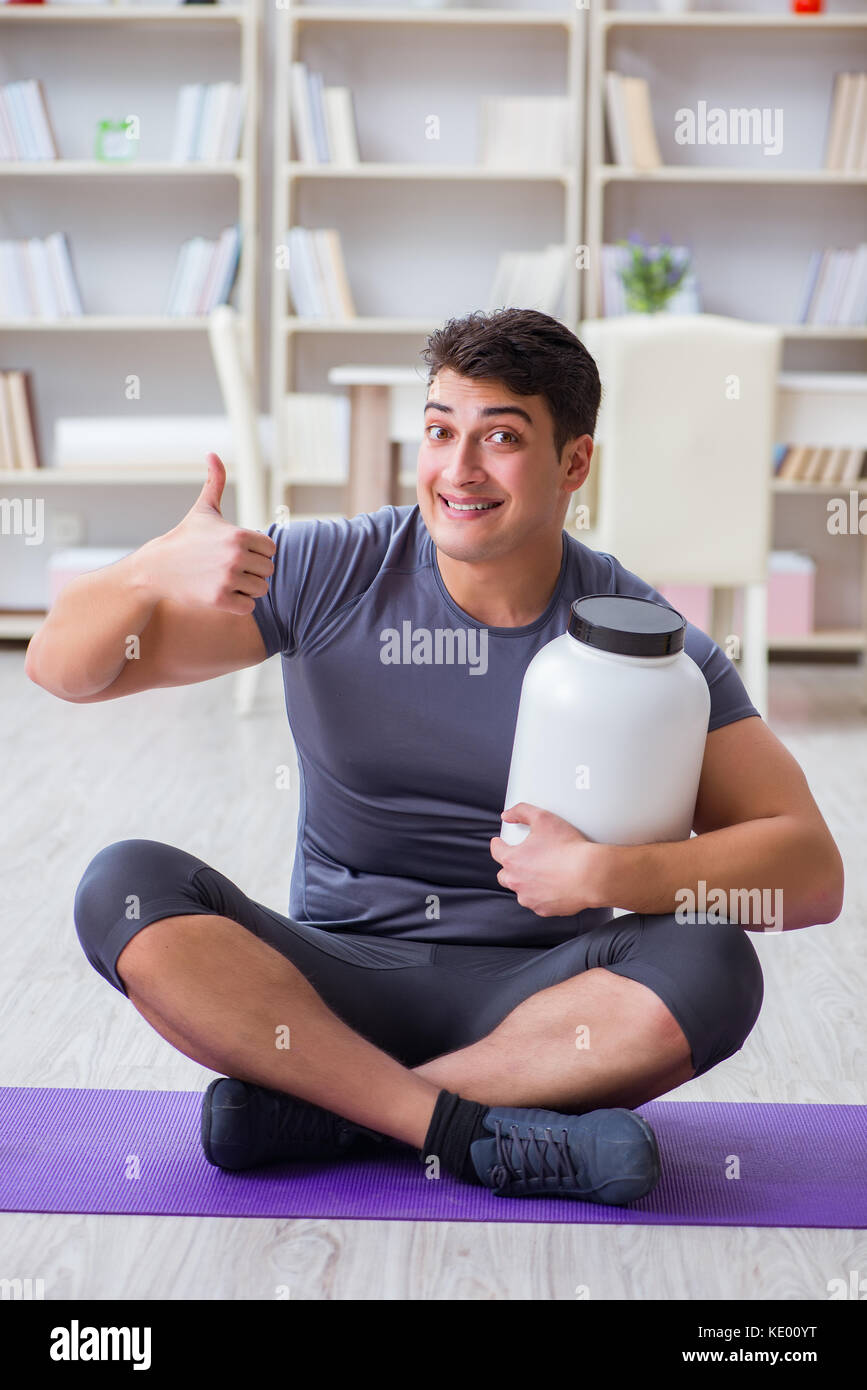 Man with food supplements in sports and healthy lifestyle concept Stock ...