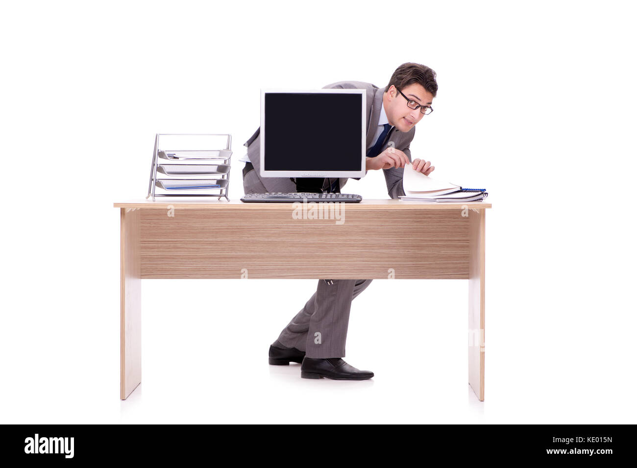 Businessman hiding in the office isolated on white Stock Photo - Alamy
