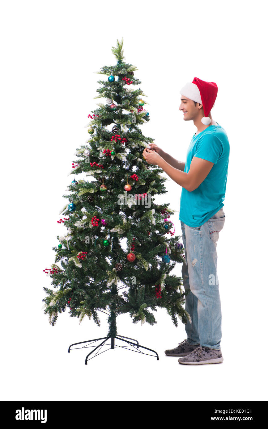 Young man decorating christmas tree isolated on white Stock Photo - Alamy