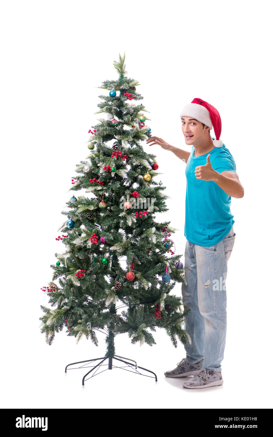 Young man decorating christmas tree isolated on white Stock Photo - Alamy