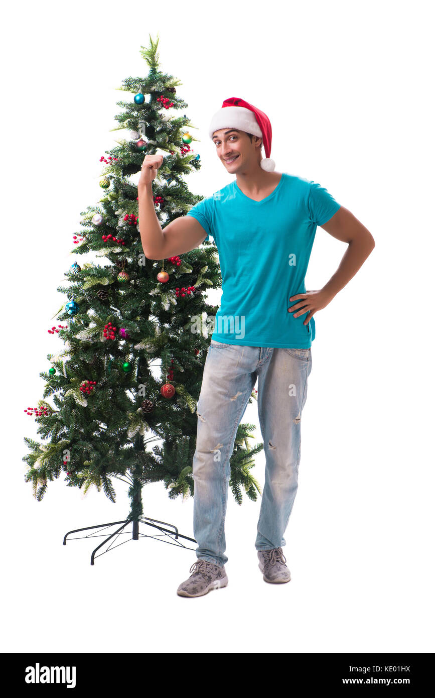 Young man decorating christmas tree isolated on white Stock Photo - Alamy