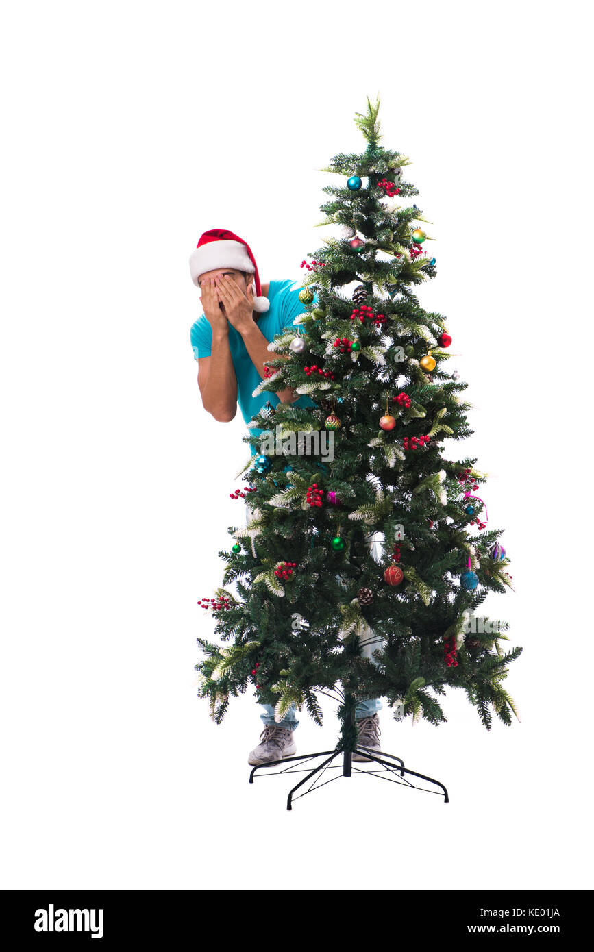 Young man decorating christmas tree isolated on white Stock Photo - Alamy