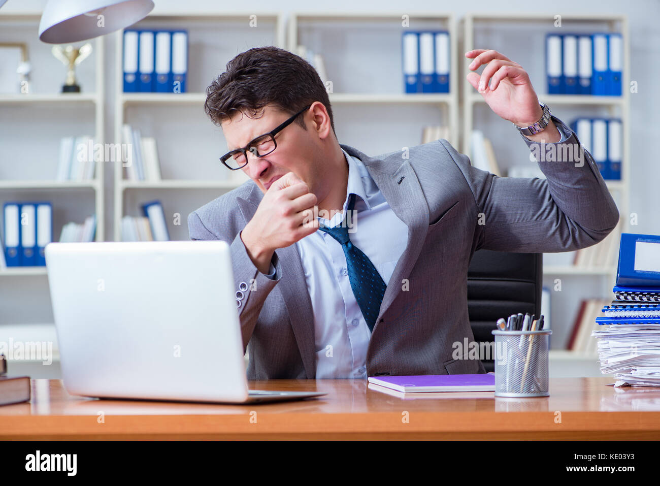 Businessman sweating excessively smelling bad in office at workplace ...