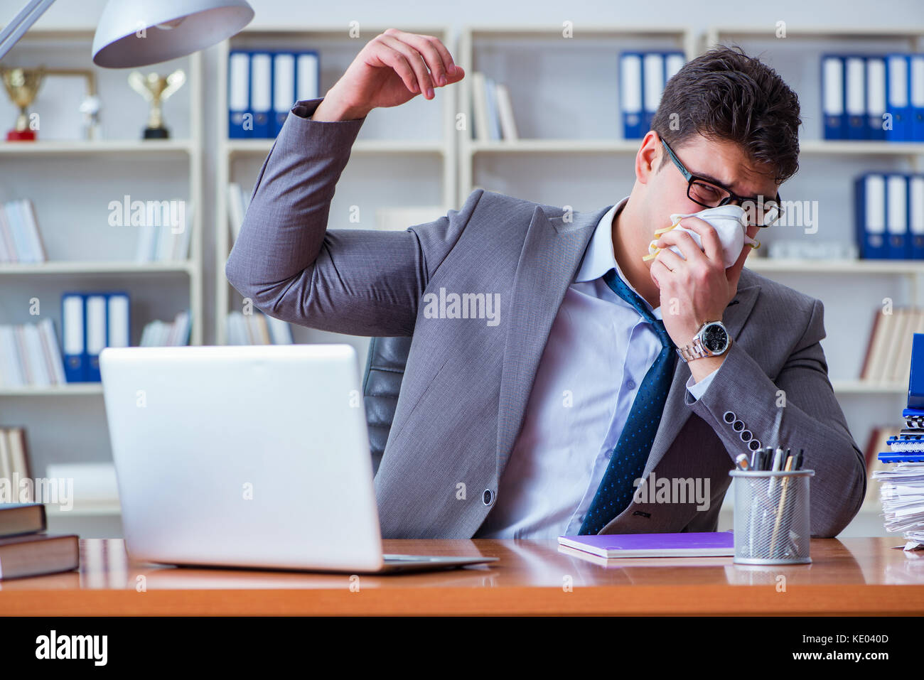Businessman sweating excessively smelling bad in office at workplace ...