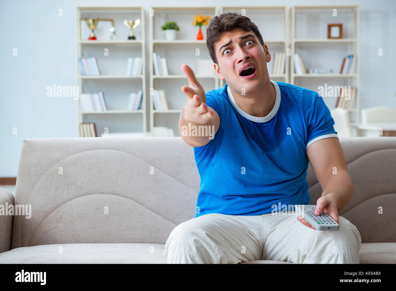 Man sweating excessively smelling bad at home Stock Photo - Alamy