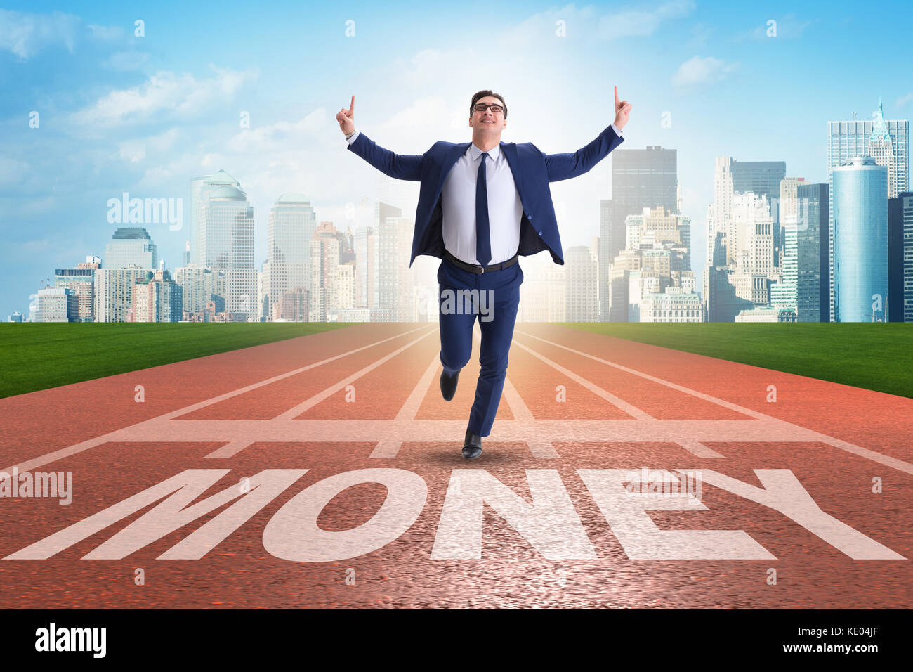 Businessman running towards money on track Stock Photo - Alamy