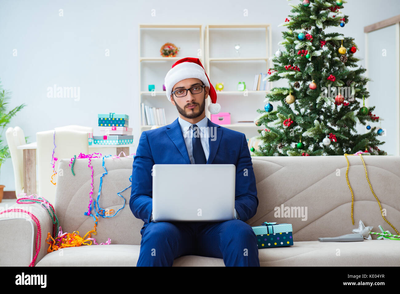 Businessman working at home during christmas Stock Photo - Alamy