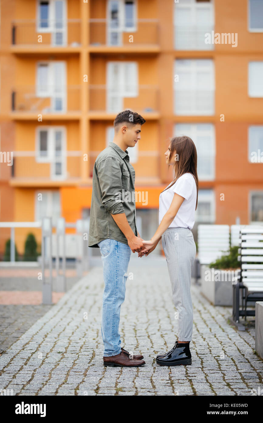 Attractive Young Couple Holding Hands And Looking At Each Other Stock 5420
