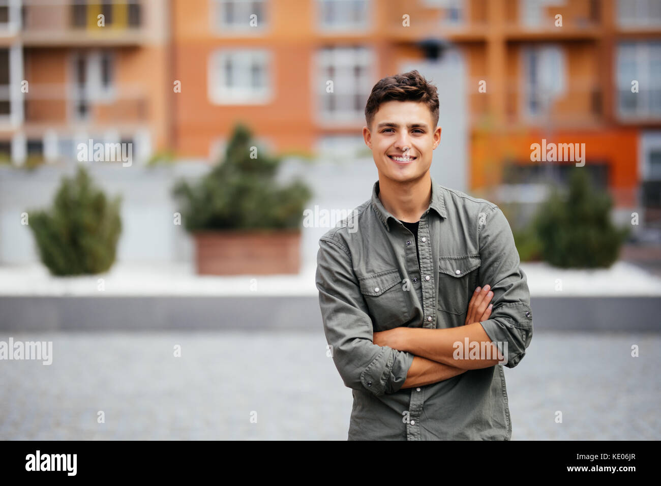 Handsome smiling young man portrait. Cheerful men looking at camera ...