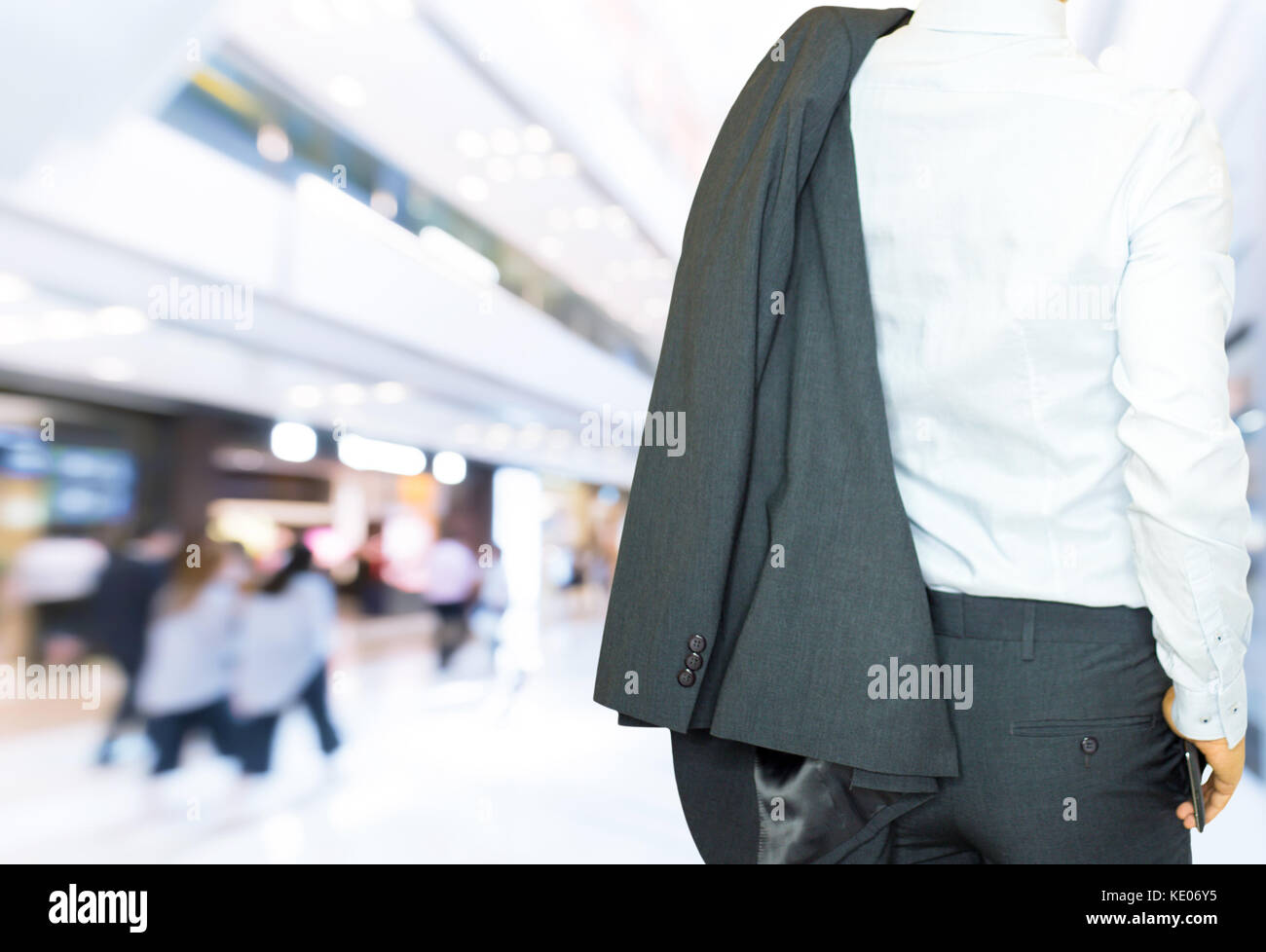 isolated business man on shopping mall background Stock Photo - Alamy