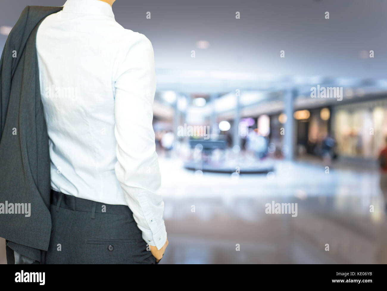 isolated business man on shopping mall background Stock Photo - Alamy