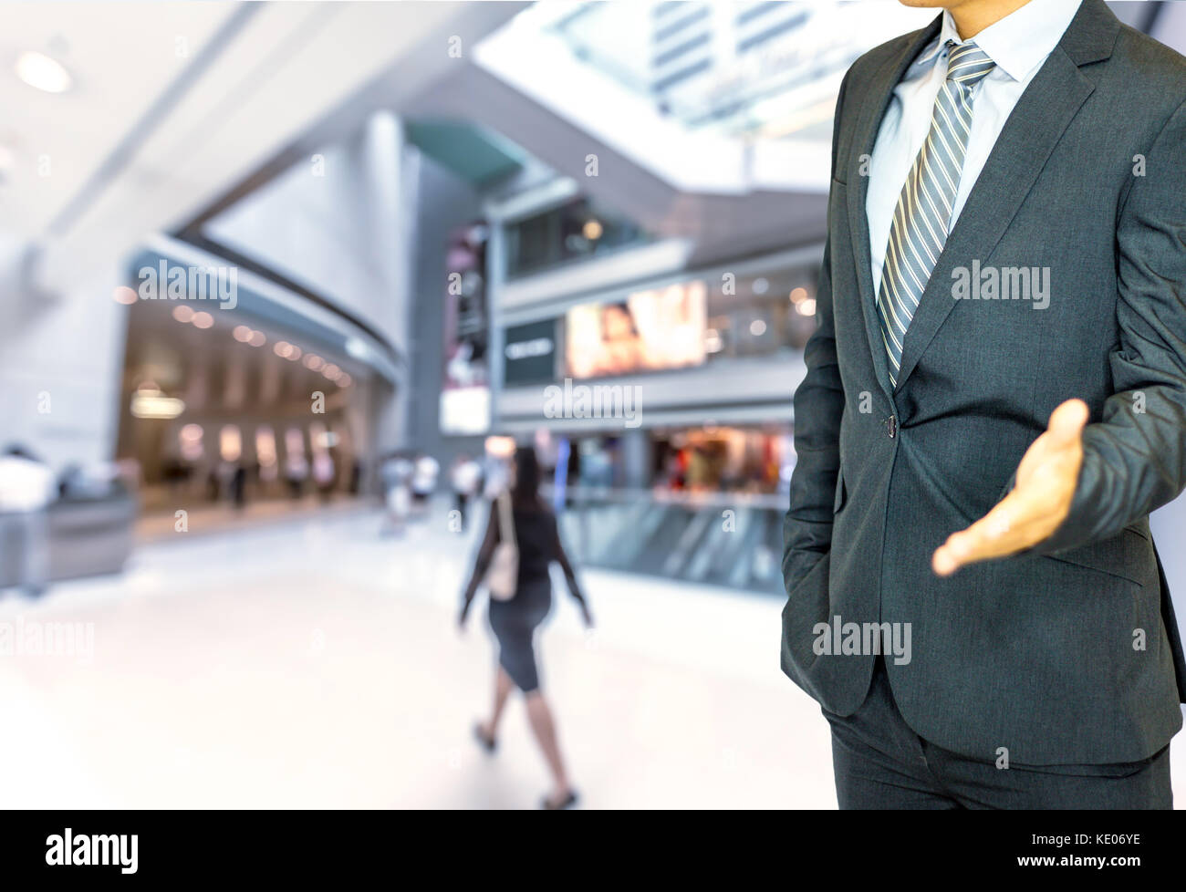 isolated business man on shopping mall background Stock Photo - Alamy