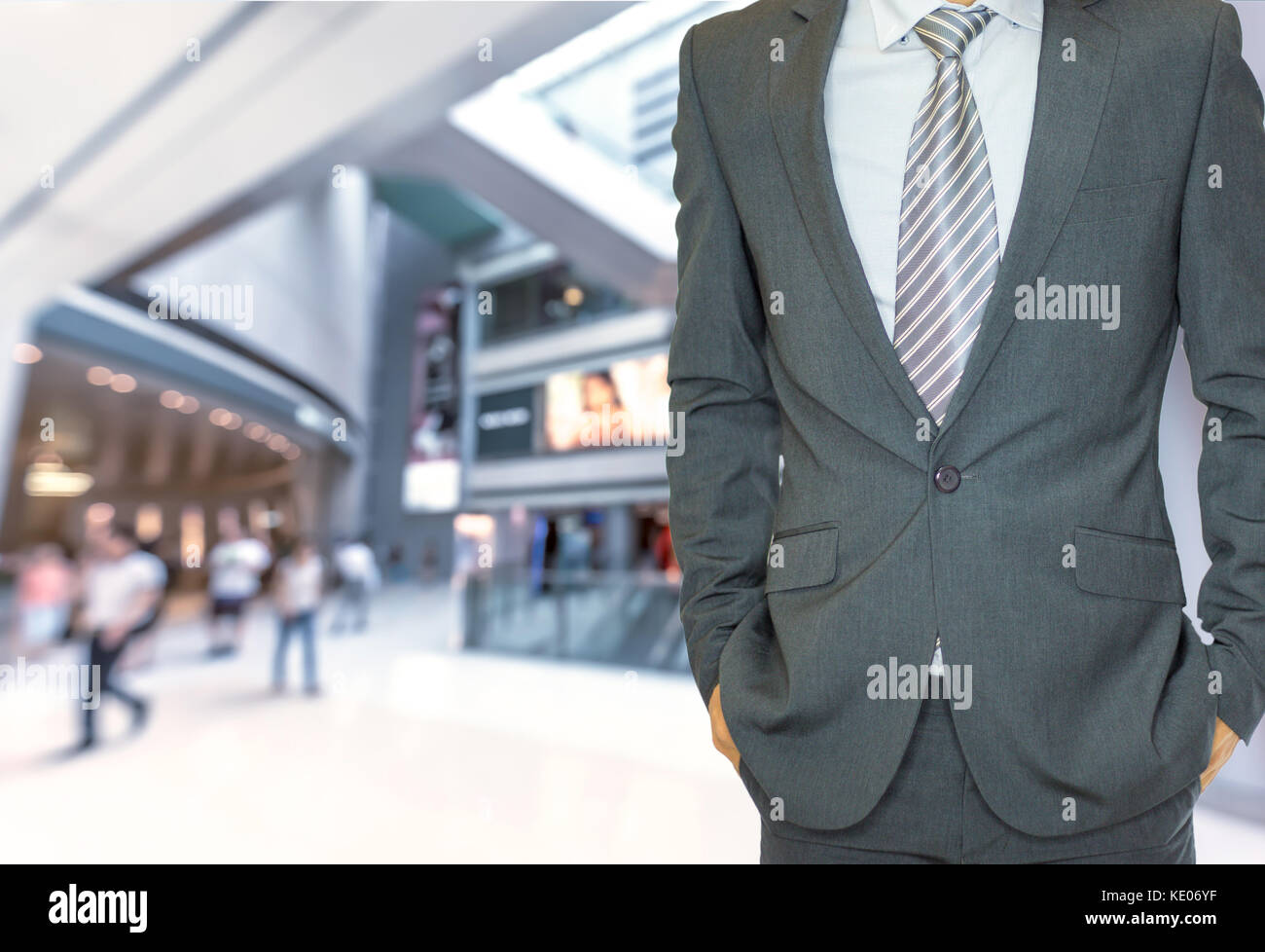 isolated business man on shopping mall background Stock Photo - Alamy