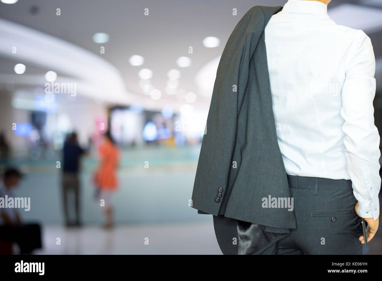 isolated business man on shopping mall background Stock Photo - Alamy