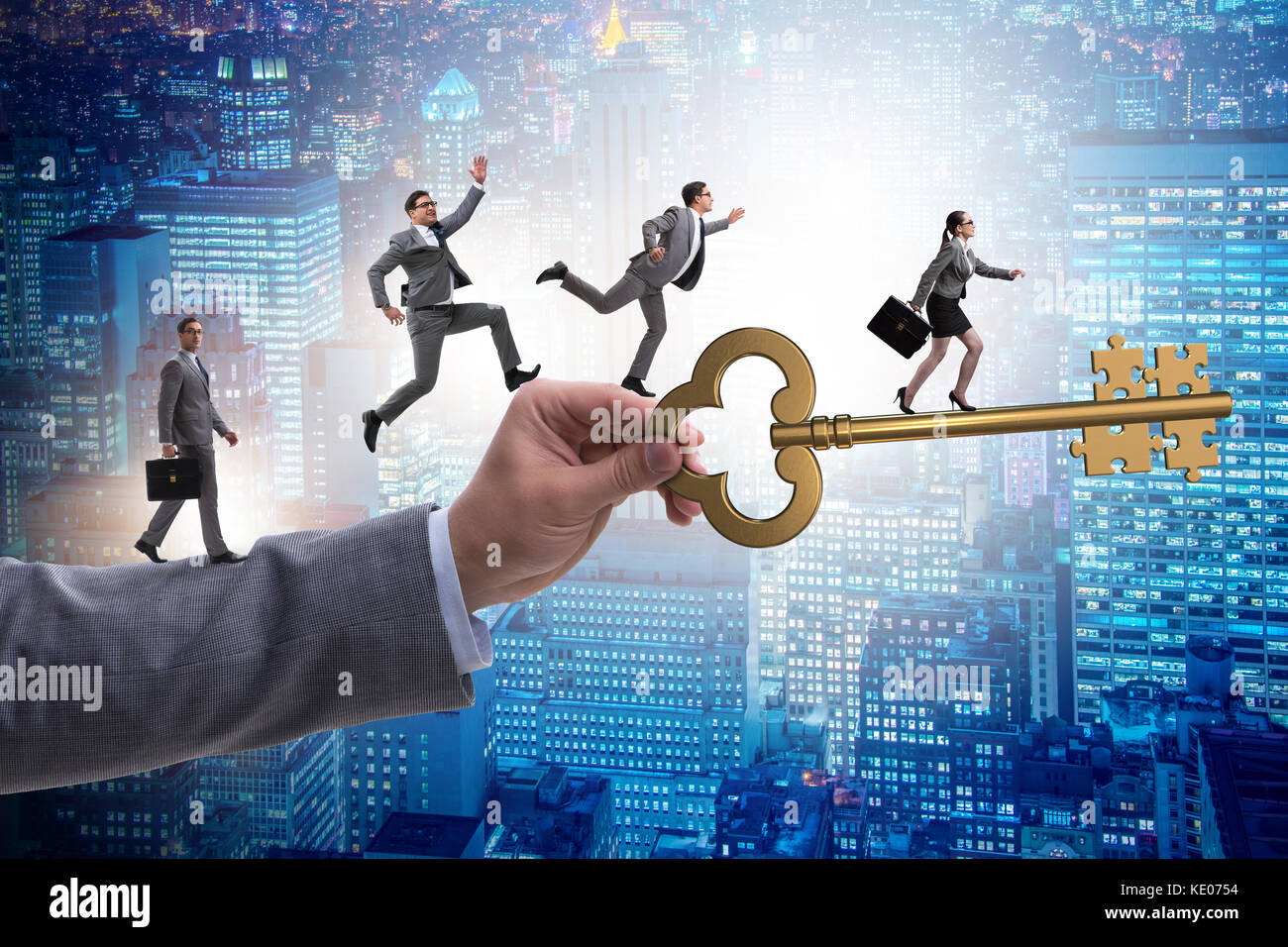 Business people chasing each other towards key to success Stock Photo ...