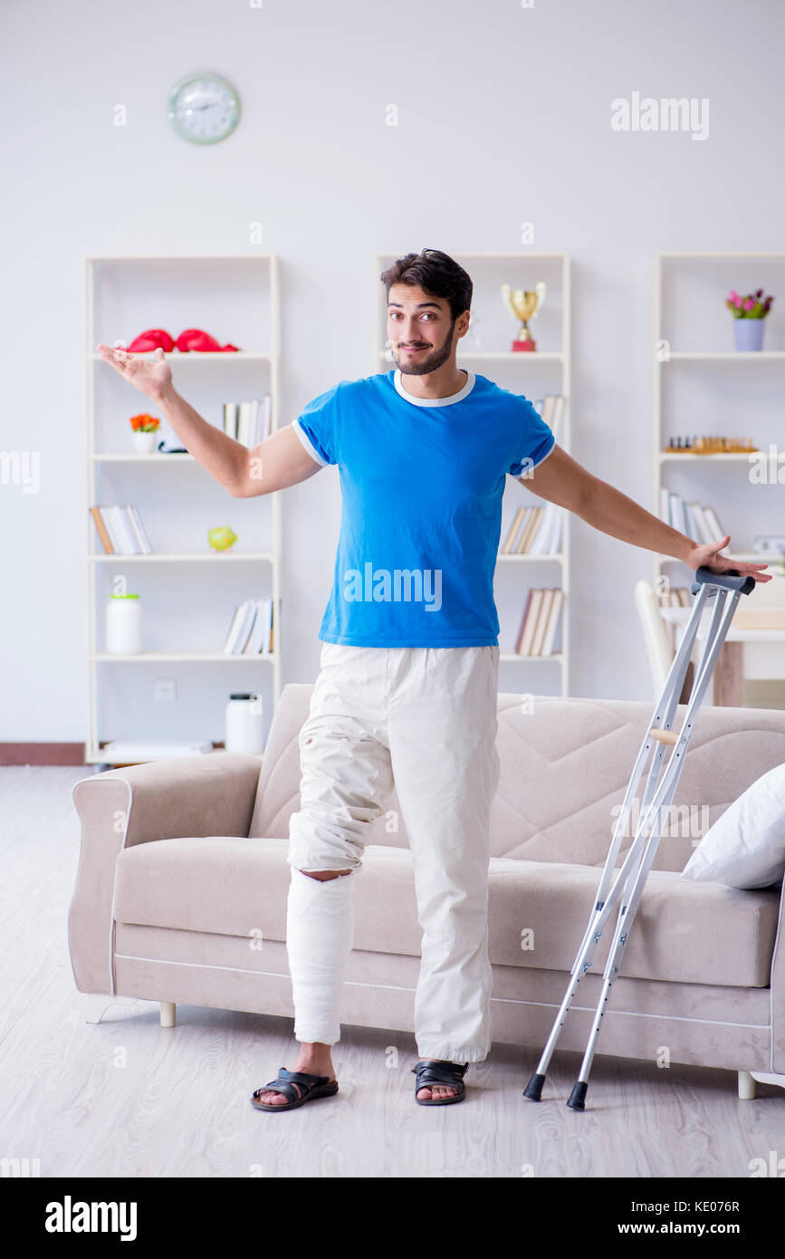 Injured young man recovering at home Stock Photo - Alamy