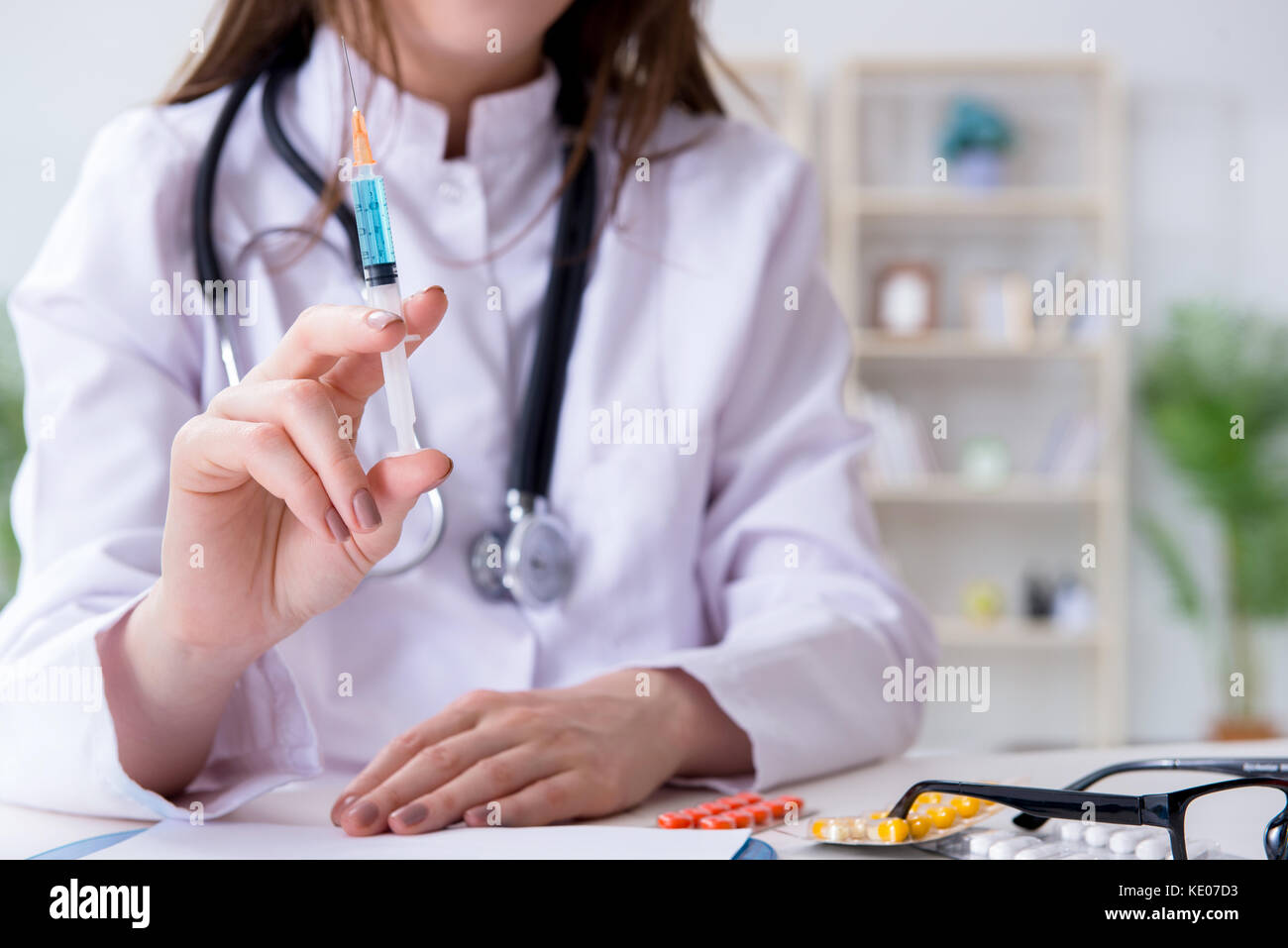 Doctor with syringe in the hospital Stock Photo - Alamy