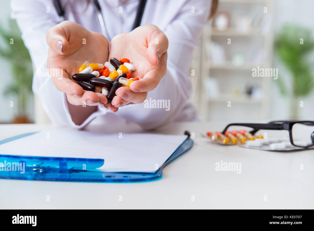 Doctor with pills working in hospital Stock Photo - Alamy