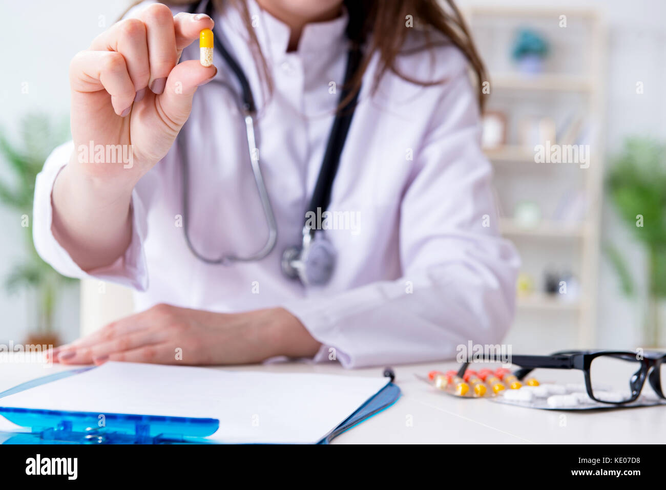 Doctor with pills working in hospital Stock Photo - Alamy