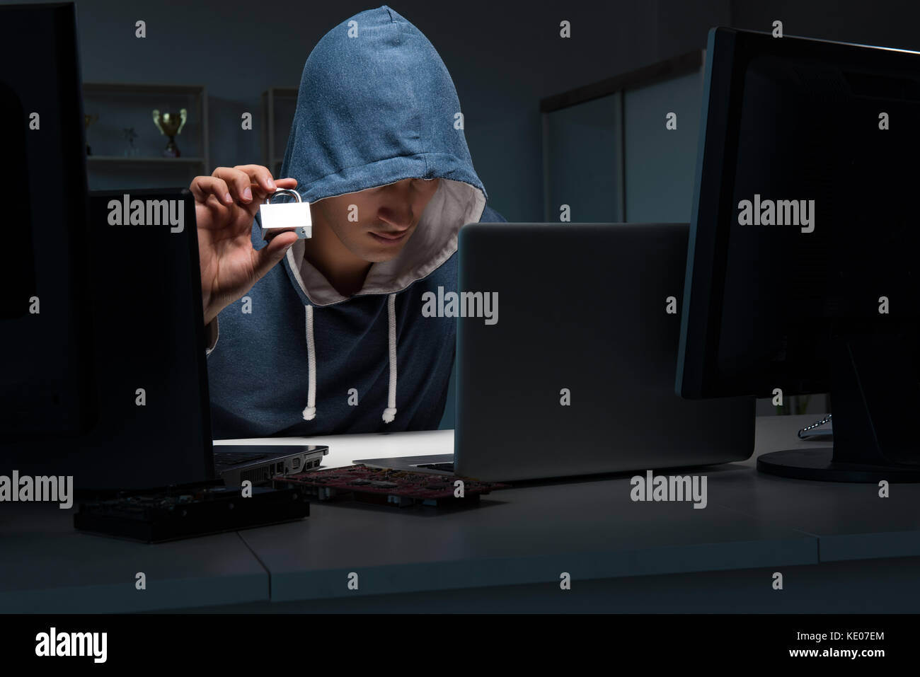 Hacker hacking computer at night Stock Photo - Alamy