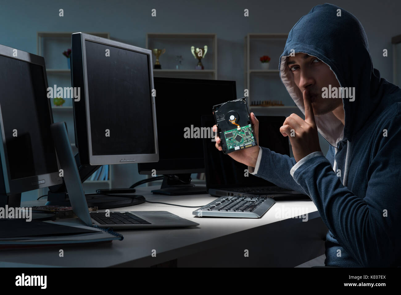 Hacker hacking computer at night Stock Photo - Alamy