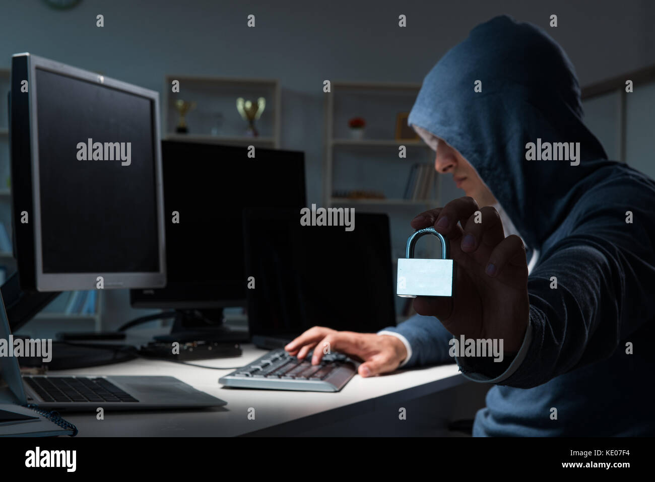 Hacker hacking computer at night Stock Photo - Alamy