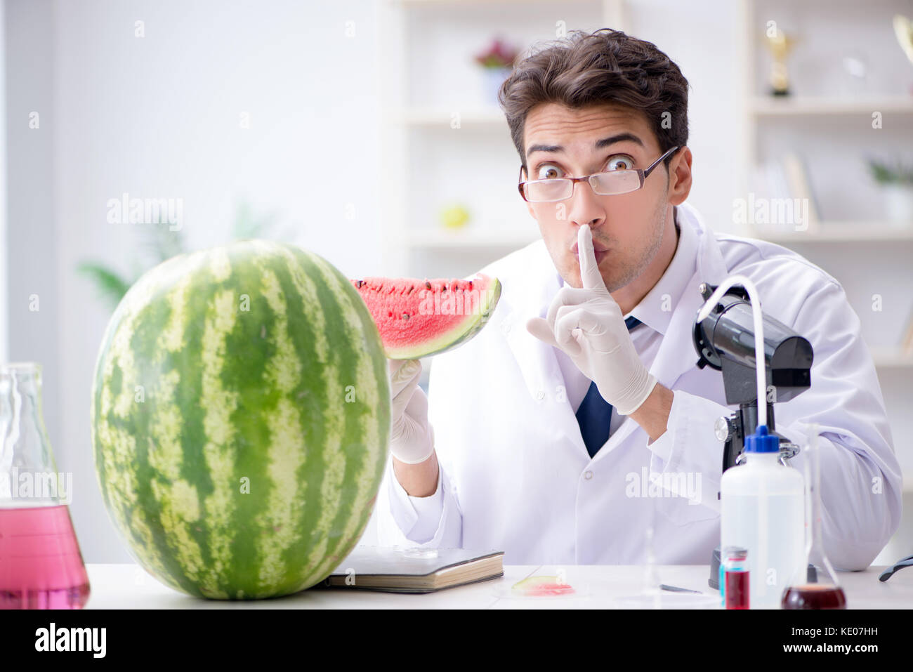 Scientist testing watermelon in lab Stock Photo - Alamy