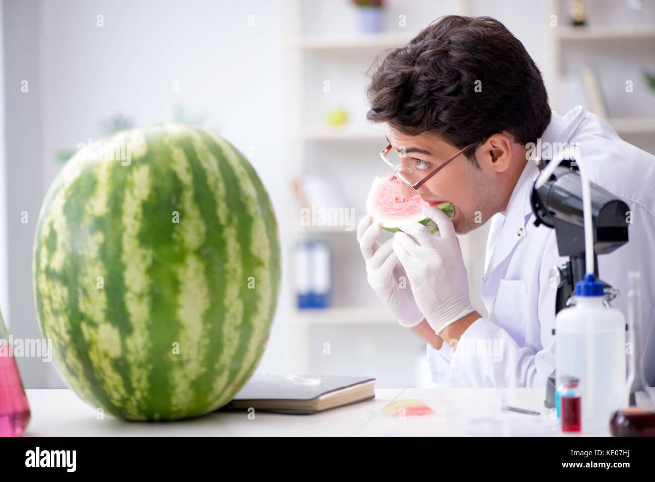 Scientist testing watermelon in lab Stock Photo - Alamy
