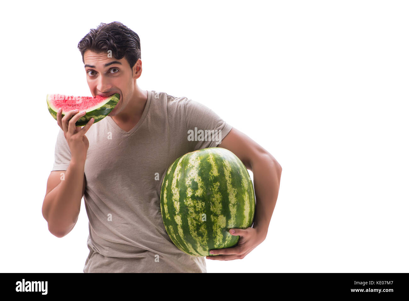 Young man with watermelon isolated on white Stock Photo - Alamy