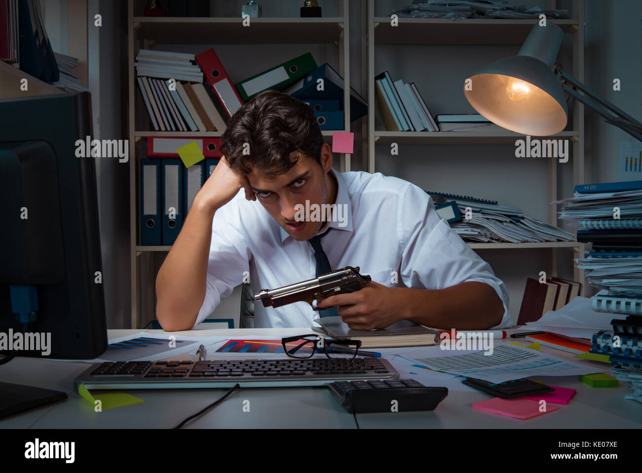 Man businessman working late hours in the office Stock Photo - Alamy