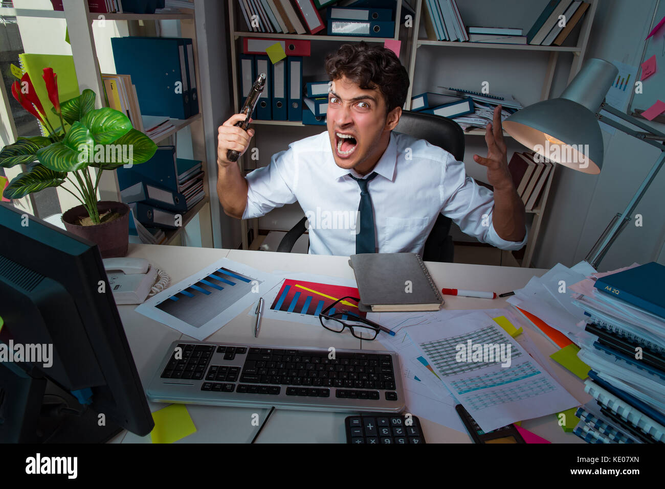 Man businessman working late hours in the office Stock Photo - Alamy