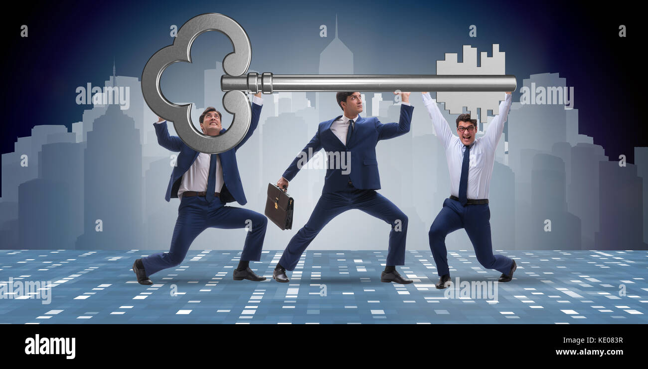 Businessmen holding giant key in business concept Stock Photo - Alamy
