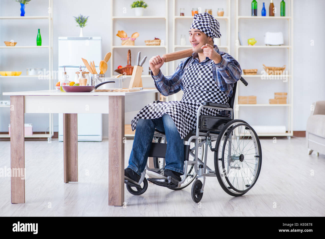 Young cook with roller preparing dough meal Stock Photo - Alamy