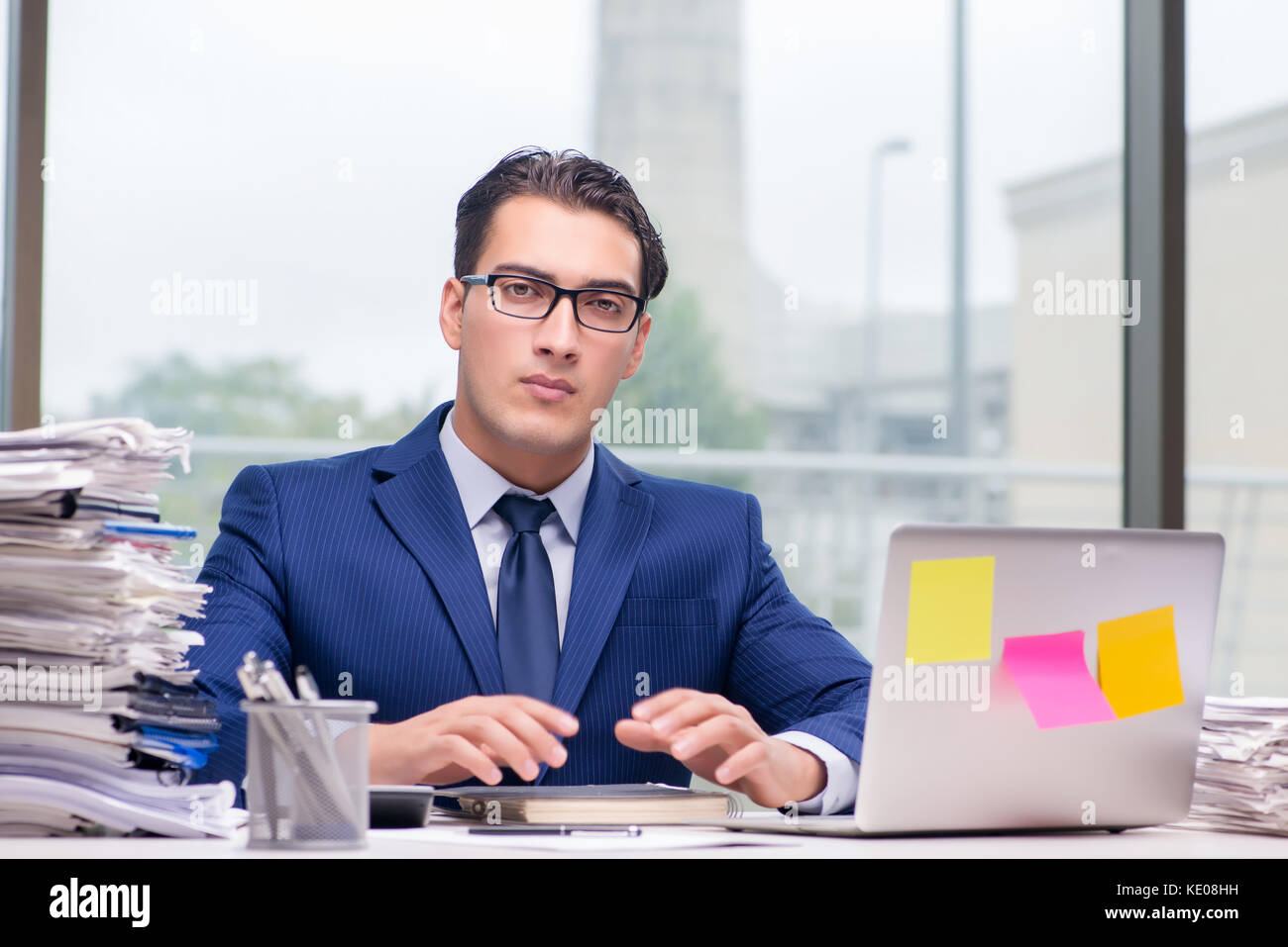 Workaholic businessman overworked with too much work in office Stock ...