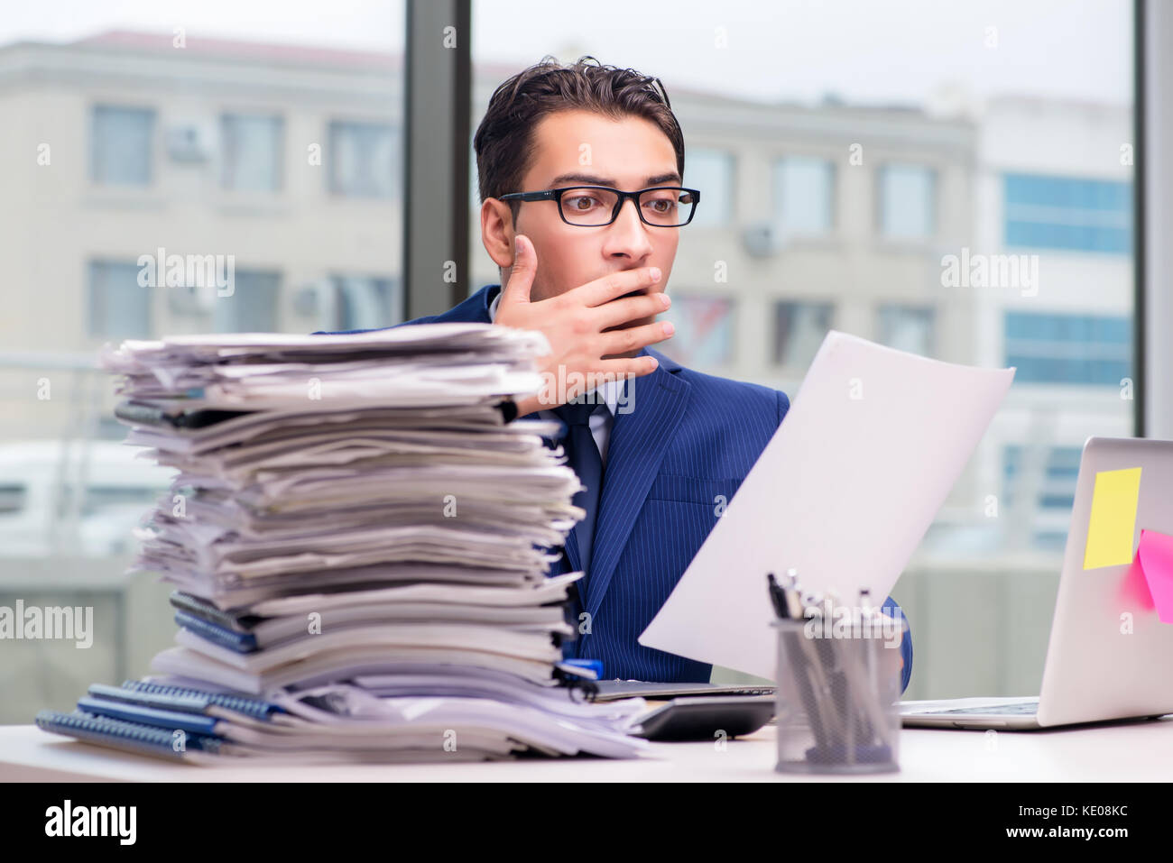 Workaholic businessman overworked with too much work in office Stock ...