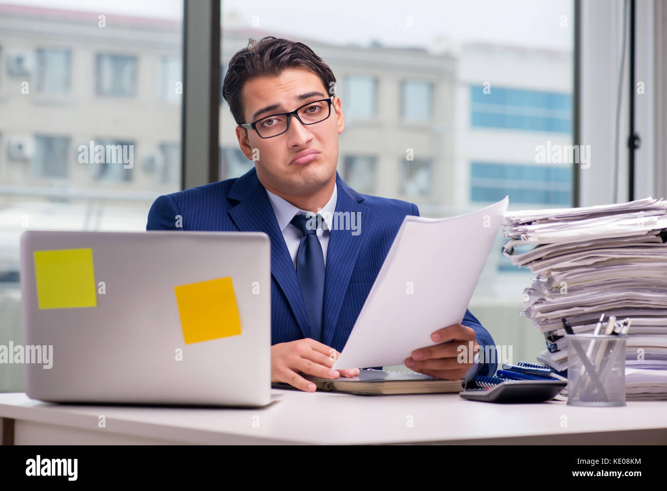 Workaholic businessman overworked with too much work in office Stock ...