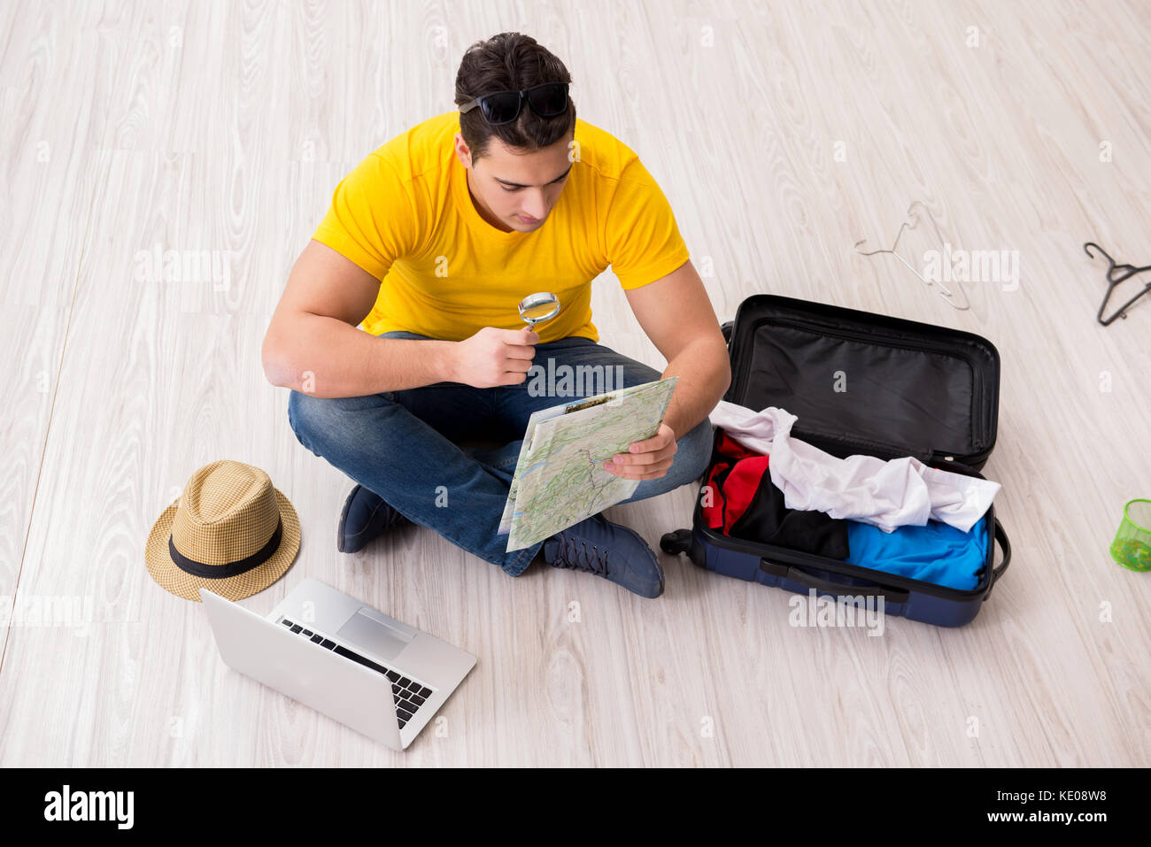 Man planning his vacation trip with map Stock Photo - Alamy